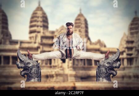 Fat karate fighter practicing against the temple Stock Photo - Alamy