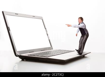businessman points a finger at laptop monitor on which a yes diagram ...