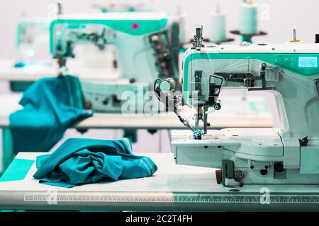 Sewing factory, nobody, overlock, stitching machines. Clothing sew ...