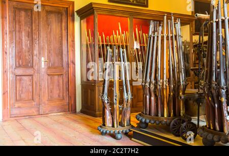 Room with old weapons, armory storage Stock Photo - Alamy
