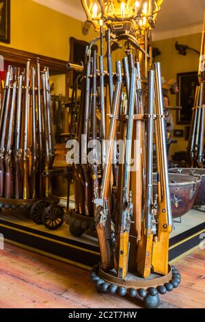 Room with old weapons, ancient armory storage, Europe. Medieval ...