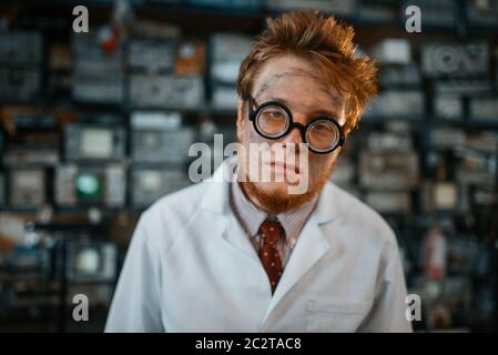 Engineer with electric lamps in ears, test in lab Stock Photo - Alamy