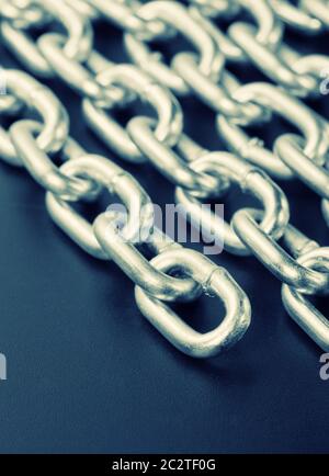 Closeup of industrial chains. Toned Stock Photo - Alamy