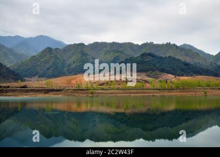 Countryside landscape, DPRK. Taedong river, village, cultivated shores ...