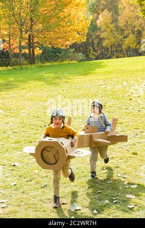 Happy boy play to fly Stock Photo - Alamy