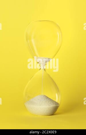 sand running through hourglass Stock Photo - Alamy