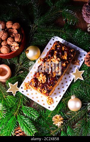 Chocolate gingerbread with filling, jam and nuts Stock Photo - Alamy