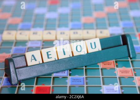 Learning english concept.Vowels of AEIOU on a blue background. Copy ...