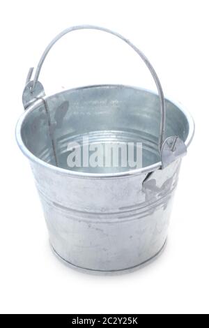 Miniature small white bucket on a green background Stock Photo - Alamy