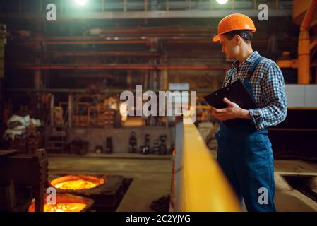 Steelmaker controls steelmaking process on factory Stock Photo - Alamy