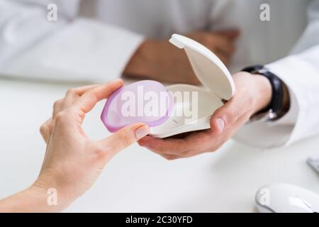 Gynecologist Consulting Woman On Diaphragm Contraception And Birth ...