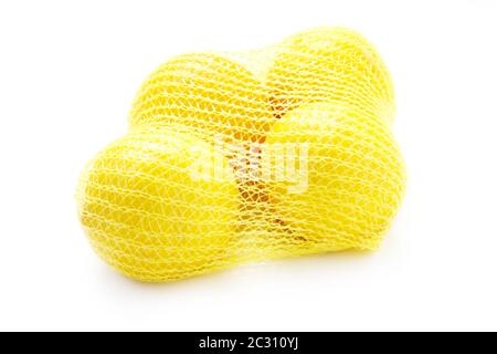 the Lemons in net packaging in the grocery store Stock Photo - Alamy