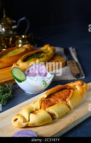Pide with minced meat, spinach, feta and feta cheese Stock Photo - Alamy