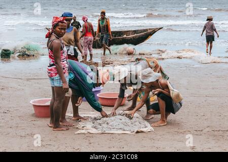 An indigenous woman fishing on a dugout canoe in várzea forest ...