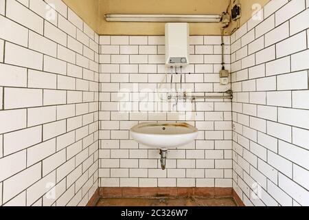 Old bathroom installation washroom Stock Photo - Alamy