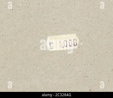 One thousand pounds price tag on cardboard packet Stock Photo - Alamy