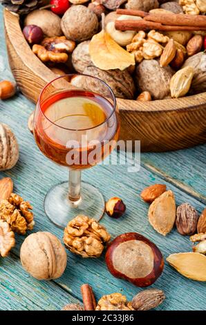 Shot glass with aromatic alcohol from nuts.Nut liquor.Tincture on nuts ...