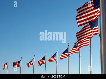 US flags near the Washington Monument. USA banner on Independence Day ...