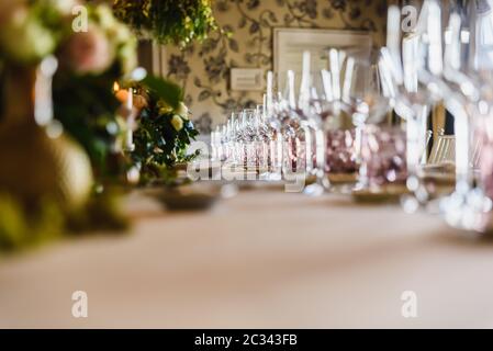 Elongated table with all the cutlery elegantly arranged and beautiful ...