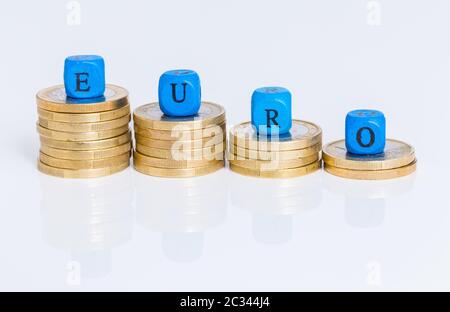 Euro letter cubes with coins against white background Stock Photo - Alamy