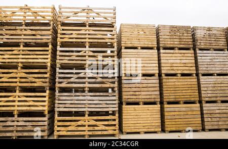 Empty wooden crates in room Stock Photo - Alamy