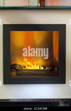 Modern square electric fireplace with led lights Stock Photo - Alamy