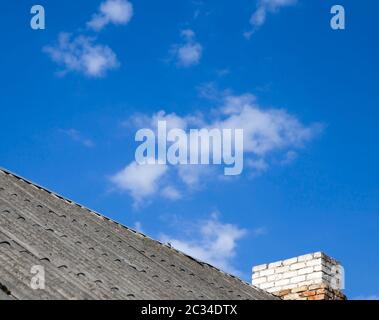 Brick pipe on the roof of a private house Stock Photo - Alamy