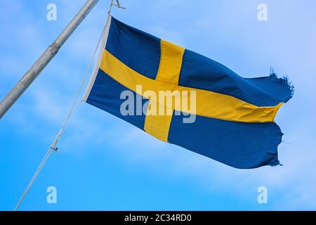 Swedish Flag Yellow Cross Over Blue at Sky Stock Photo - Alamy