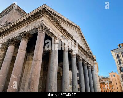 Facade of ancient building with columns and triangular portico. Action ...