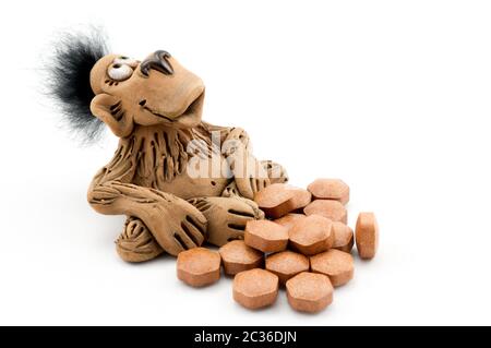Photo of a monkey Clay Sculpture and pills Stock Photo - Alamy