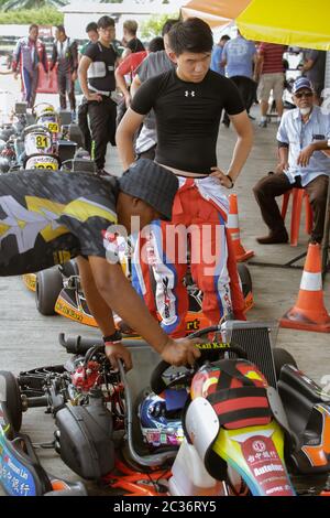 Kart racers getting ready for routine checkout procedure after a race ...