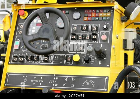 Heavy construction industry cockpit with wheel and buttons Stock Photo ...