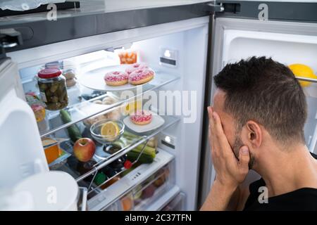 Bad Smell In Fridge. Rotten Food In Refrigerator Stock Photo - Alamy