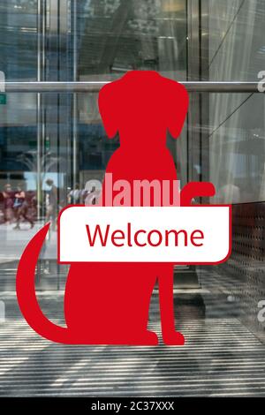 Dogs Welcome sign outside shop. Green dog-friendly sign. Welcome sign ...