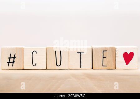 Wooden cubes with a hashtag and the word twitter near white background ...