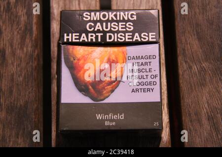 An example of plain cigarette packaging in Australia warning that ...