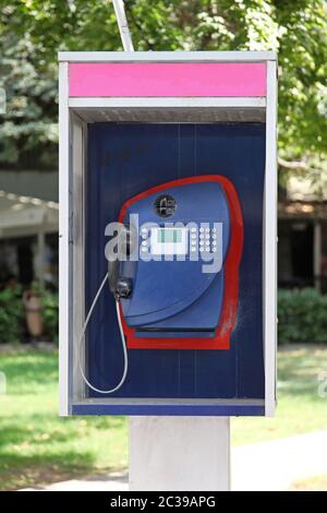 Modern blue payphone booth with card slot Stock Photo - Alamy