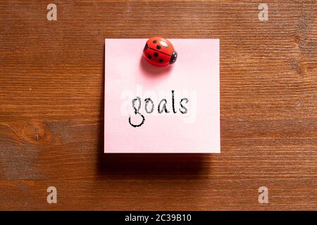 a colored memo sheet with writing goals on a transparent background ...
