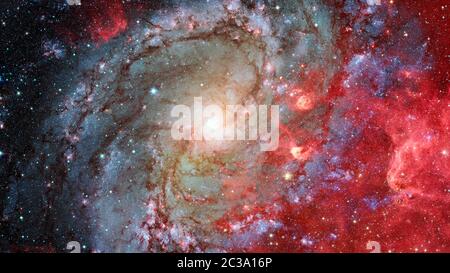 Giant spiral disk of stars, dust and gas. Elements of this image ...