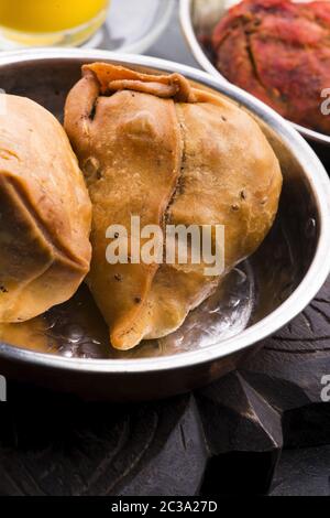 Veg Samosa - is a crispy and spicy Indian triangle shape snack Stock ...