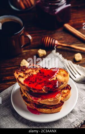 Stack of french toasts with berry marmalade on white plate Stock Photo ...