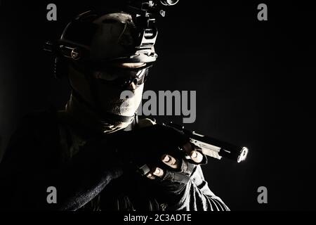 Armed SWAT fighter hiding behind ballistic shield Stock Photo - Alamy