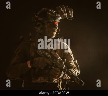 Army special forces tactical group fighter in cqb mission, using radio ...