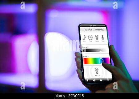 Person Controlling Light With App On Phone Stock Photo - Alamy