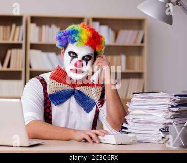 The office clown at computer desk and computer Stock Photo - Alamy