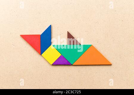 Color tangram puzzle in shark or whale shape on wood background Stock ...
