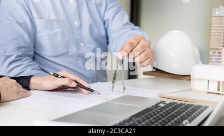 Person's engineer Hand Drawing Plan On Blue Print with architect ...