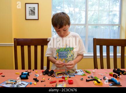 Austin Texas USA, 2013: Seven-year-old Mexican-American boy figures out ...