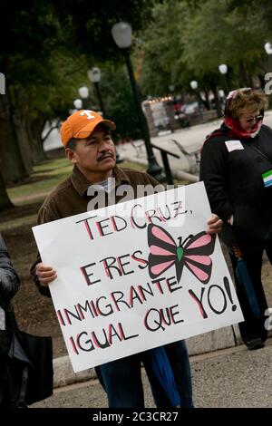 A protester holds a sign during the rally against the Donald Trump ...