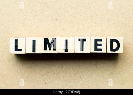 Letter block in word limited on wood background Stock Photo - Alamy